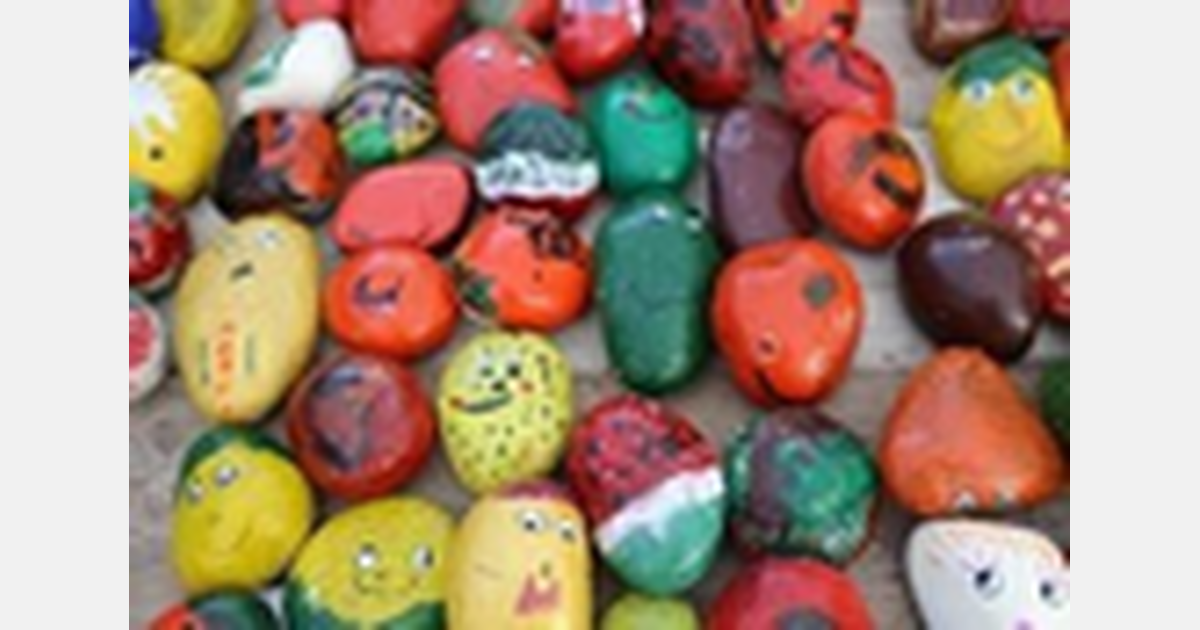 Swapping painted pebbles for free vegetable seeds